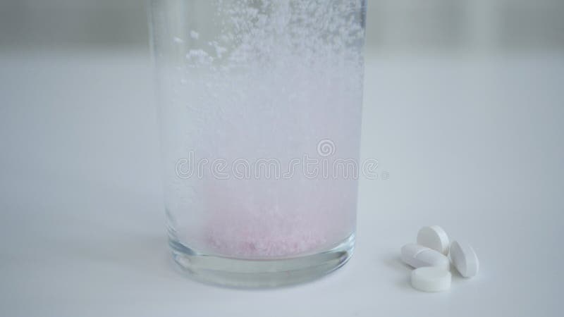 Medicine Effervescent Pill Dissolved with Bubbles in a Glass of Water ...
