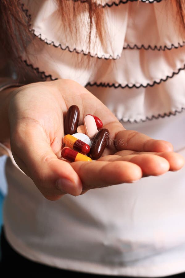 Medicine on hand stock photo. Image of tablets, hands - 26959134