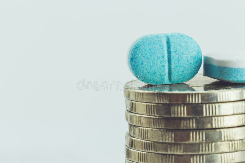Medicine Pills and Coin Stack Stock Photo - Image of health, coins ...