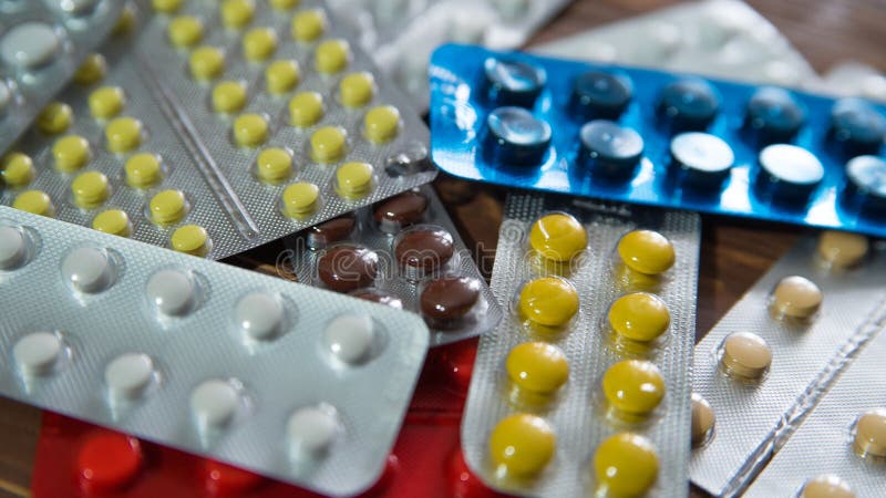 Medicine Pills on a Wooden Table Stock Image - Image of variation ...
