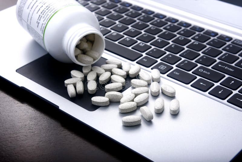 Medicine Tablets on a Laptop Computer. Stock Photo - Image of medical ...