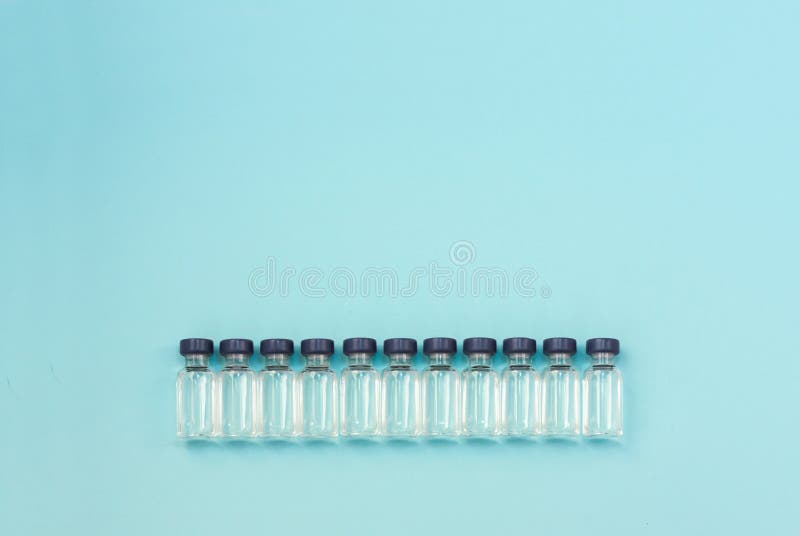 Medicine in Vials, Ready for Vaccine Injection and Syringe on Blue ...