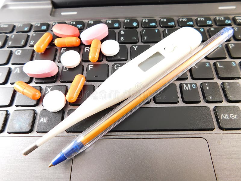 Medicines on the Keyboard of a Computer. Stock Photo - Image of cure ...