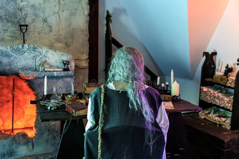 Medieval Alchemist Workshop with Caucasian Female Alchemist at Work ...