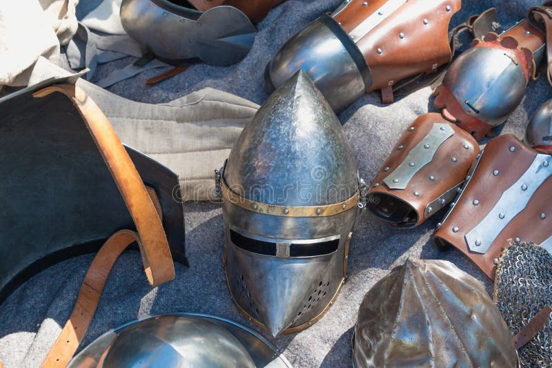 Medieval Armor Collection Featuring Helmets and Gauntlets on Display ...