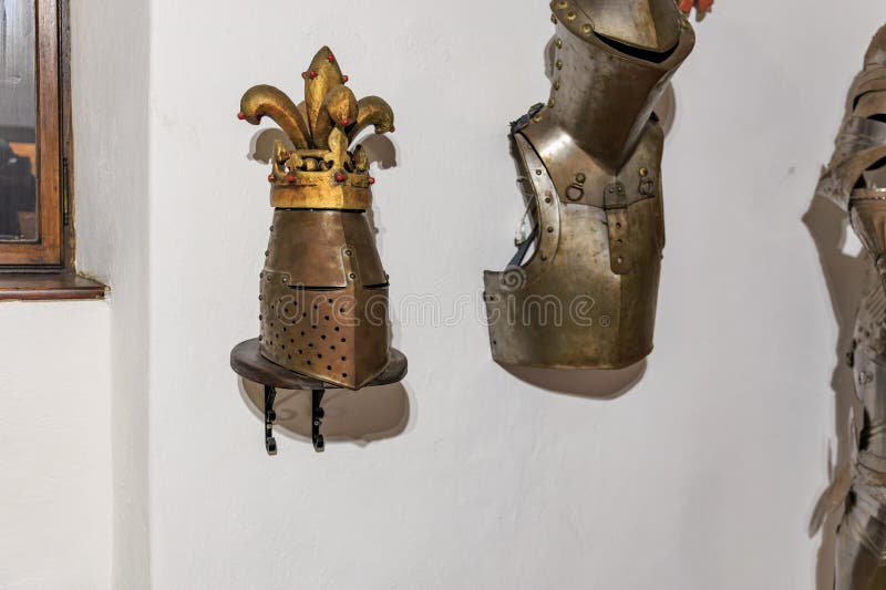 Medieval Armor Display with Decorative Helmet and Breastplate on Wall ...