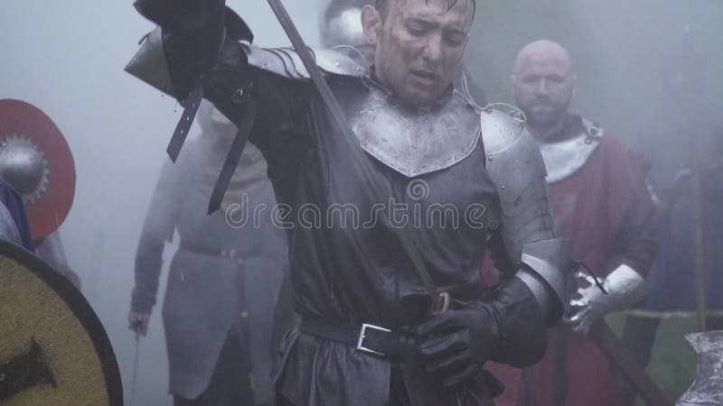 Medieval Battlefield, General is Pulling Out His Sword in the Smoke ...