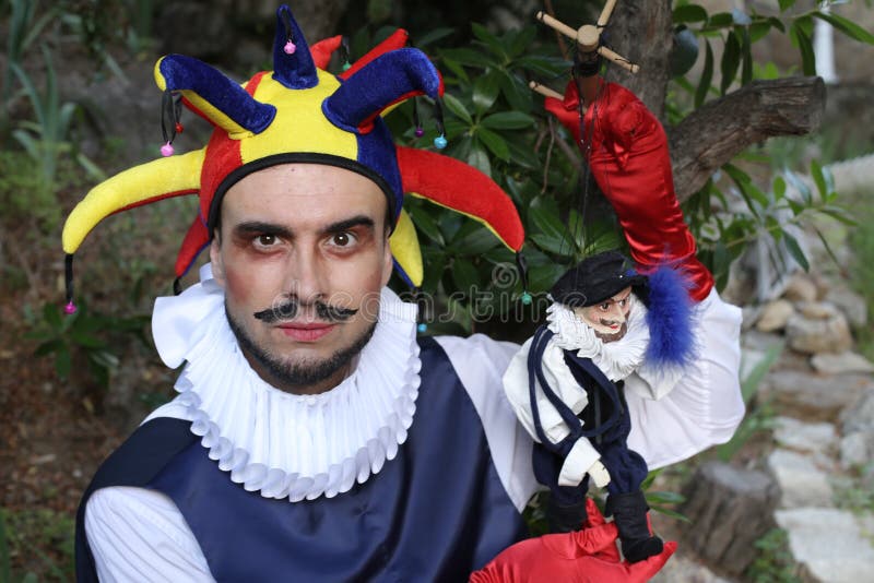 Medieval Buffoon with a Puppet Stock Photo - Image of masquerade ...