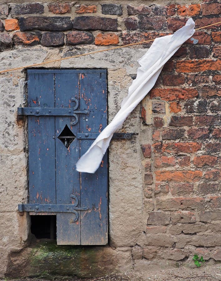 Medieval Castle Door and Wash on the Line Stock Image - Image of house ...