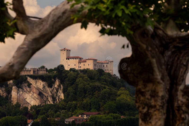 Medieval Castle Overlooking a Lush Green Hillside Framed by Tree ...