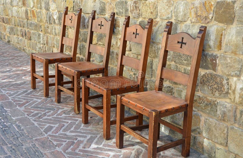 Medieval Chairs on Brick Patio Stock Photo - Image of rustic, seat ...