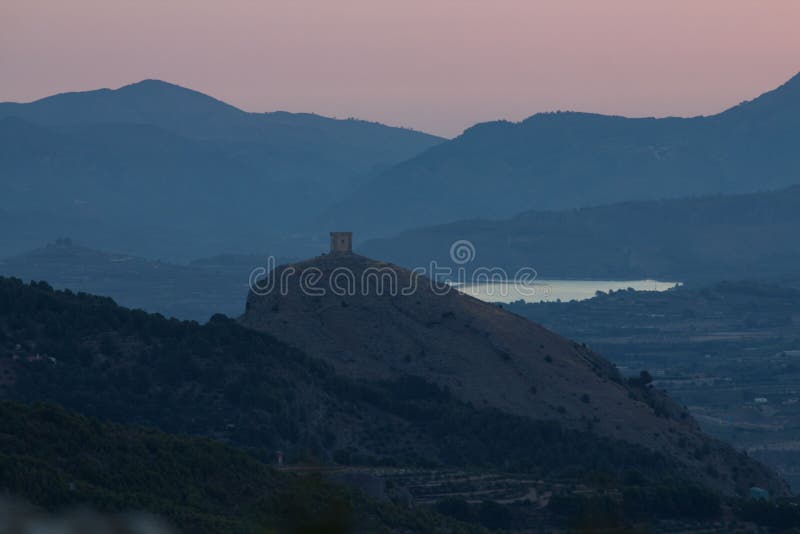 Cocentaina Castle in Spain on Top of a Hill with Mountains and a Sunset ...