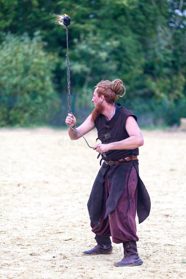 Medieval Fire-eater Juggling with a Chain in Fire Editorial Photography ...