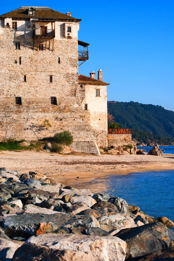 Medieval hotel by the sea stock photo. Image of rocks - 22339422