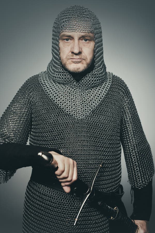 Armed Man in Chain Armor with Sword Posing for Portrait in Studio Stock ...