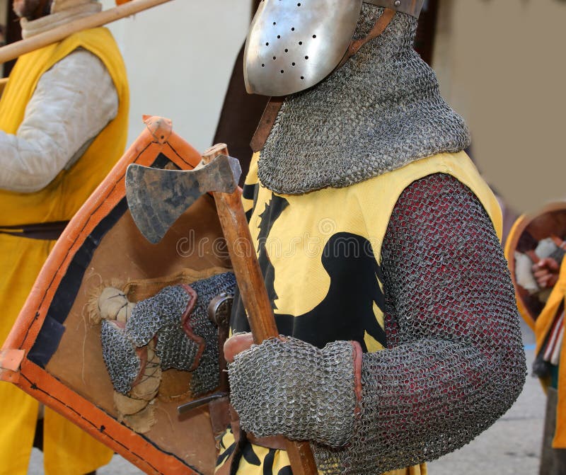 Medieval Knight with Attack Ax and Armor and Protective Metal Helmet on ...