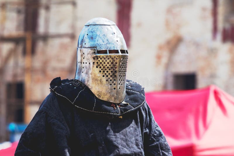 Medieval Knight in Helmet and Dark Clothing_ Stock Photo - Image of ...