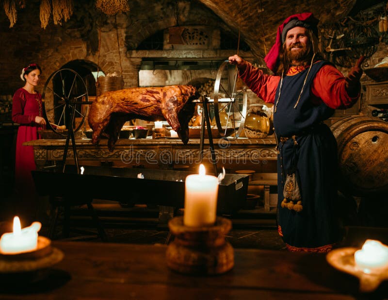 Medieval Man Doing Roasted Pig on the Rack Stock Image - Image of lord ...