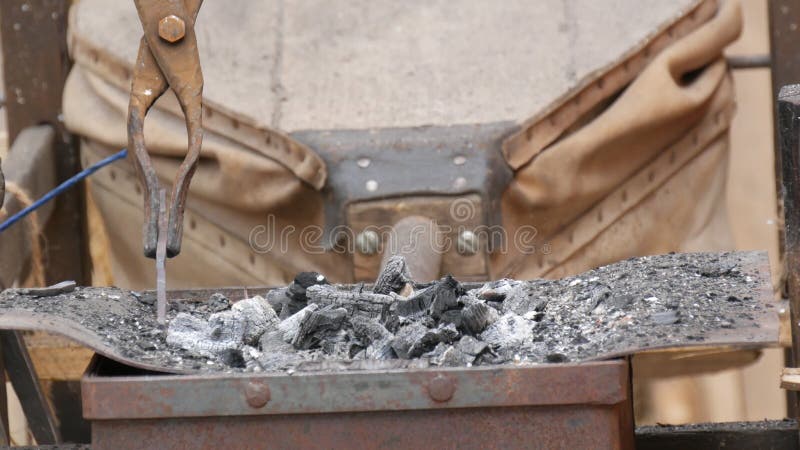 Medieval Method of Forging Iron, the Blacksmith Forges an Iron Nail ...