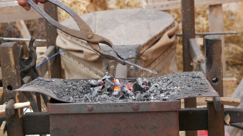 Medieval Method of Forging Iron, the Blacksmith Forges an Iron Nail ...