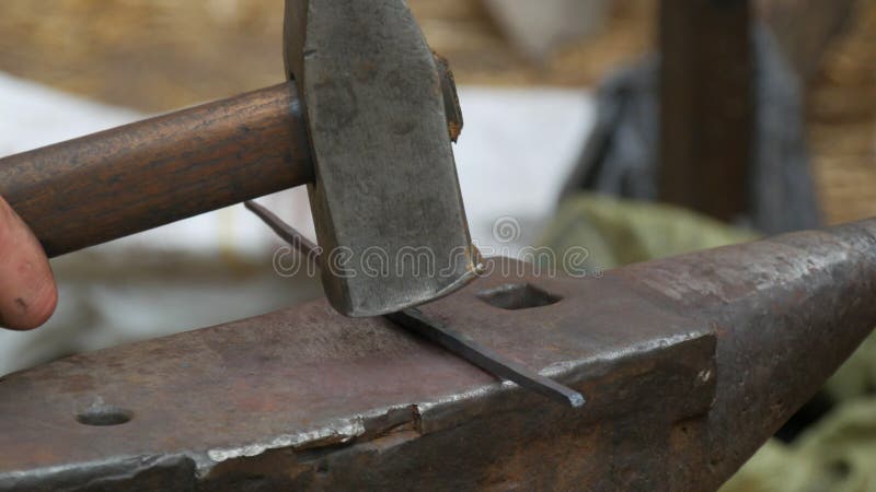 Medieval Method of Forging Iron, the Blacksmith Forges an Iron Nail ...