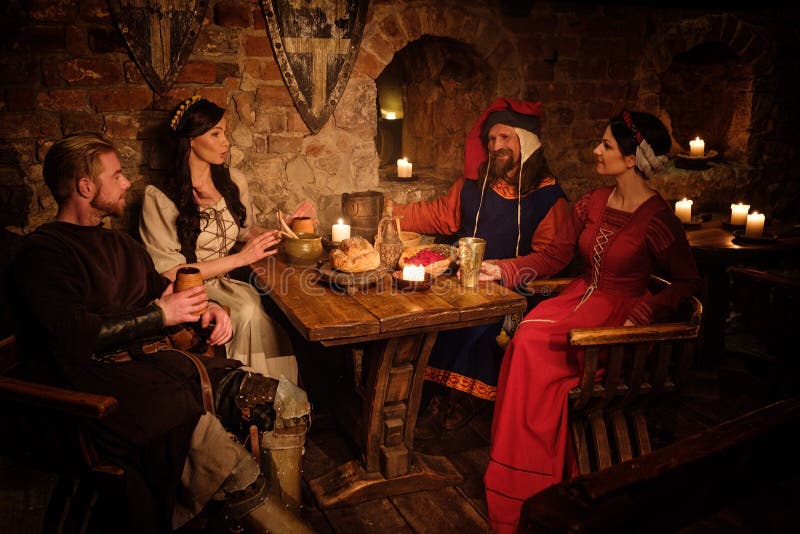 Medieval People Eat and Drink in Ancient Castle Tavern. Stock Image ...