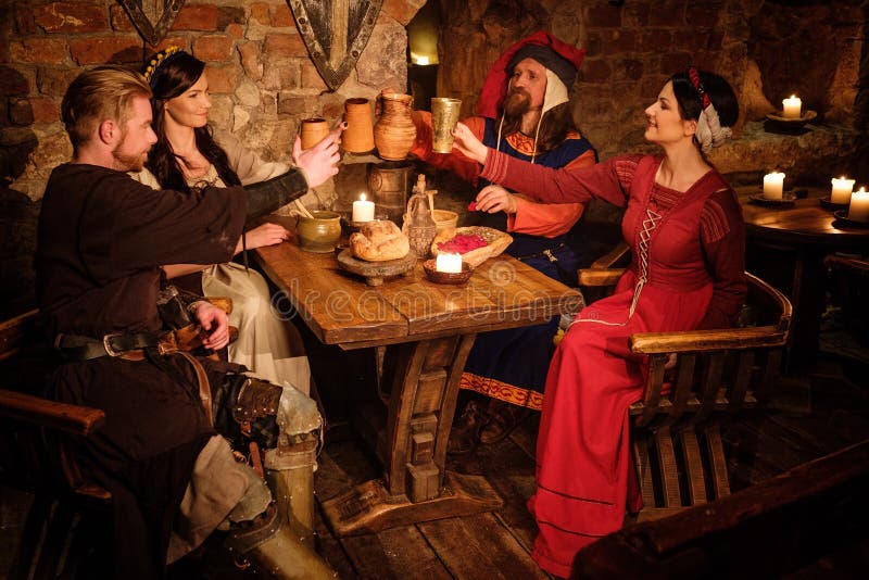 Medieval People Eat and Drink in Ancient Castle Tavern. Stock Image ...