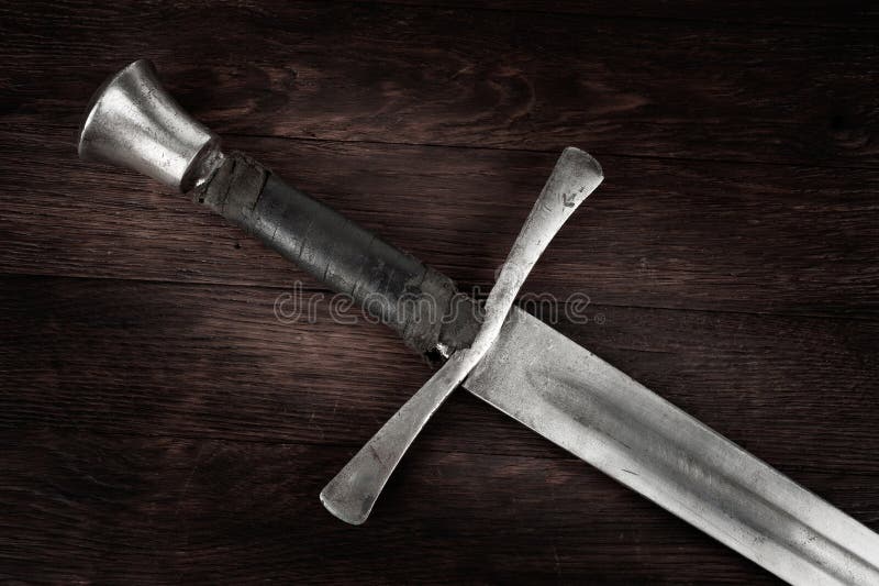 Medieval Sword on Wooden Backgrond Stock Photo - Image of chivalry ...
