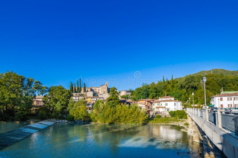 Medieval village on river stock photo. Image of italy - 78464298