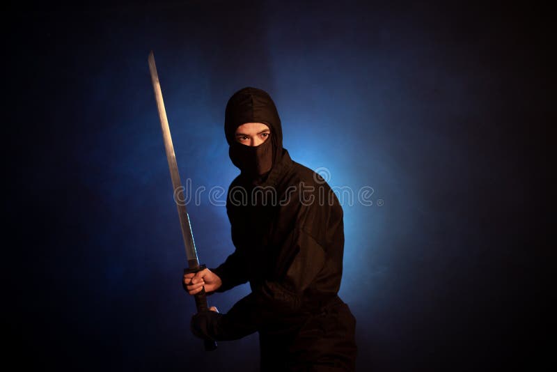 Medieval Warrior Assassin Ninja with Sword in Aggressive Pose in Smoke ...