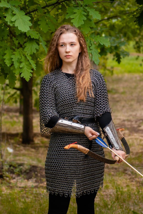 Medieval Warrior Woman in Chain Mail and Bracers with a Bow in Her ...
