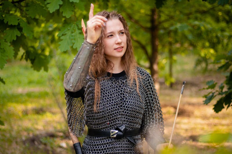 Medieval Warrior Woman in Chain Mail and Bracers with a Bow in Her ...