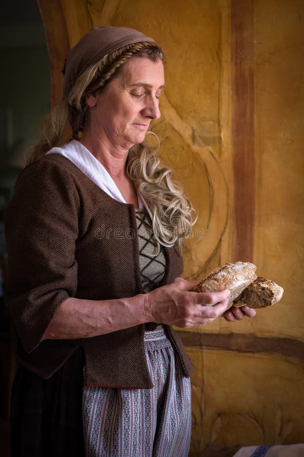 Medieval Woman Breaking Bread Stock Image - Image of dress, food: 262535559