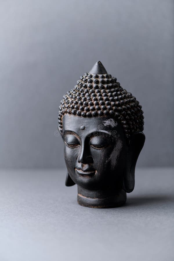 Meditating Buddha on Gray Background. Soft Focus. Close Up Stock Photo ...