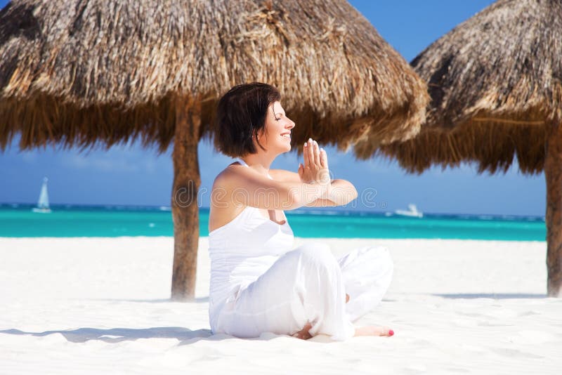 Meditation on the beach stock image. Image of lotus, beautiful - 13762671