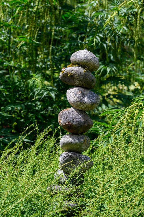 Meditation Space in Peaceful Garden with River Rock Stack, Serene Green ...