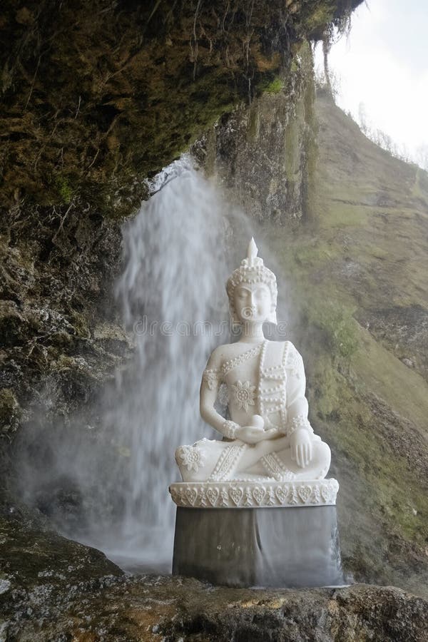 Meditative Buddha Statue with a Waterfall and Beautiful Natural Setting ...