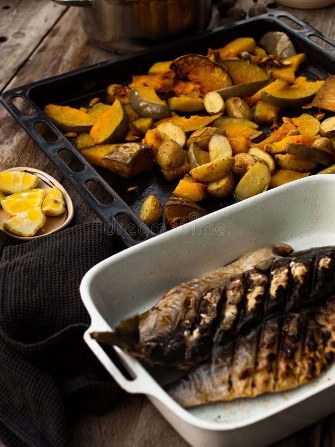 Mediterranean Fire Cooked Fish on Rustic Wooden Table Stock Photo ...