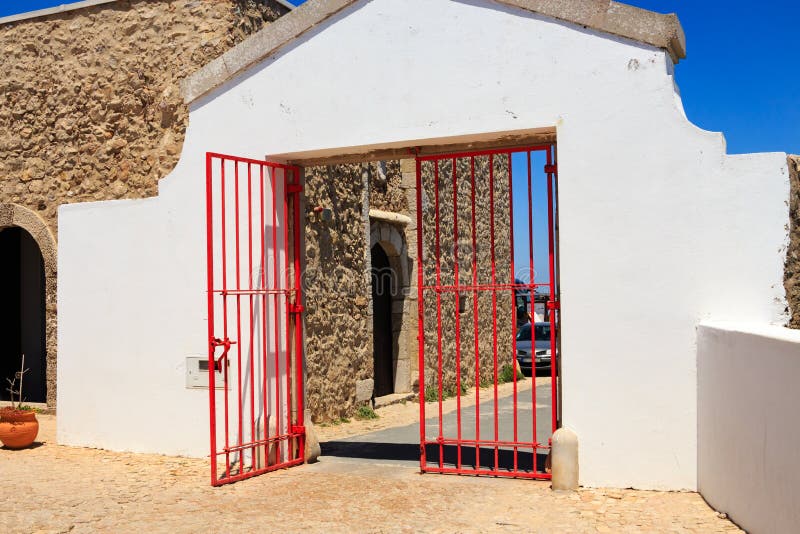 Mediterranean Gate with Red Bars Stock Photo - Image of metallic, iron ...