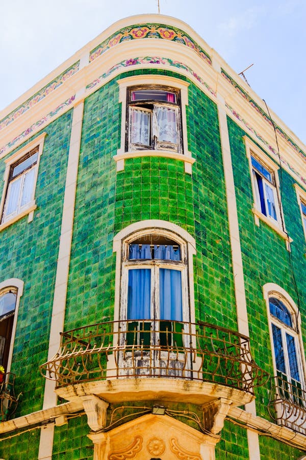 Mediterranean House Facade with Green Tiles and White Windows Stock ...