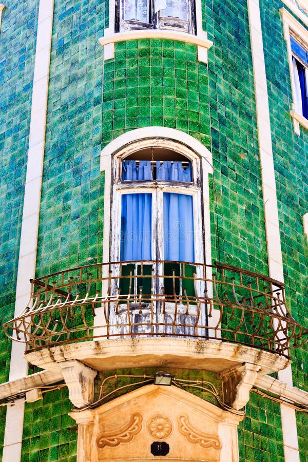 Mediterranean House Facade with Green Tiles and White Windows Stock ...