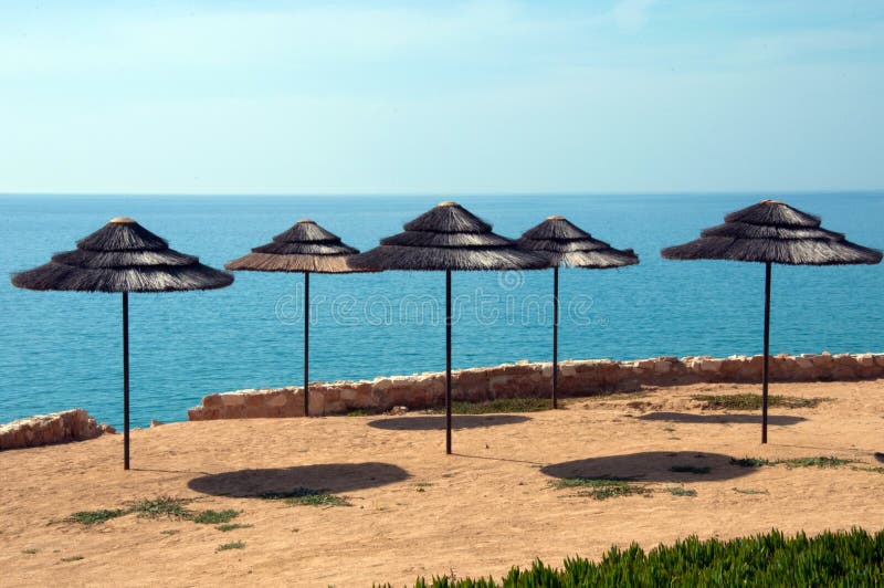 Mediterranean umbrellas stock photo. Image of beach, umbrella - 39557200