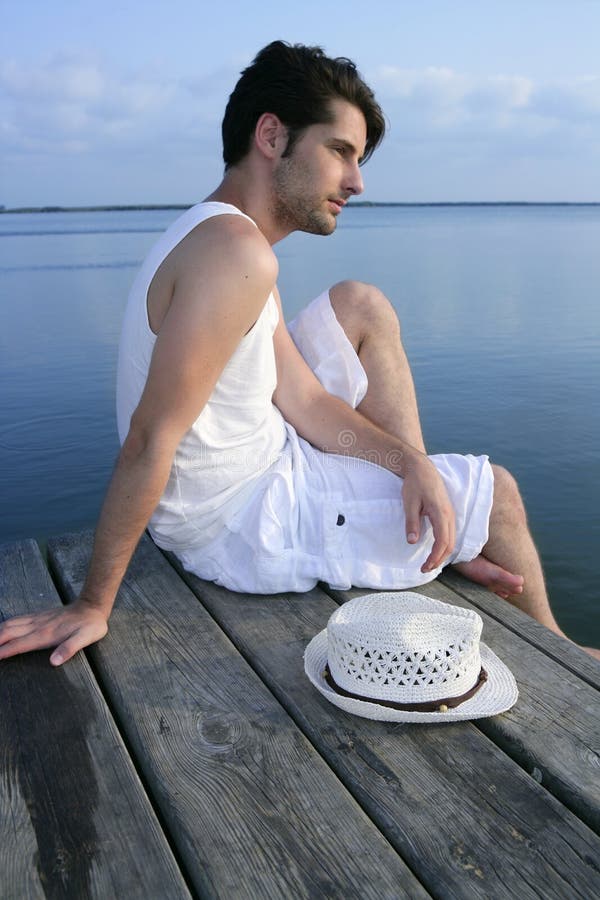Mediterranean Young Man Relaxed on Wood Pier Stock Photo - Image of ...