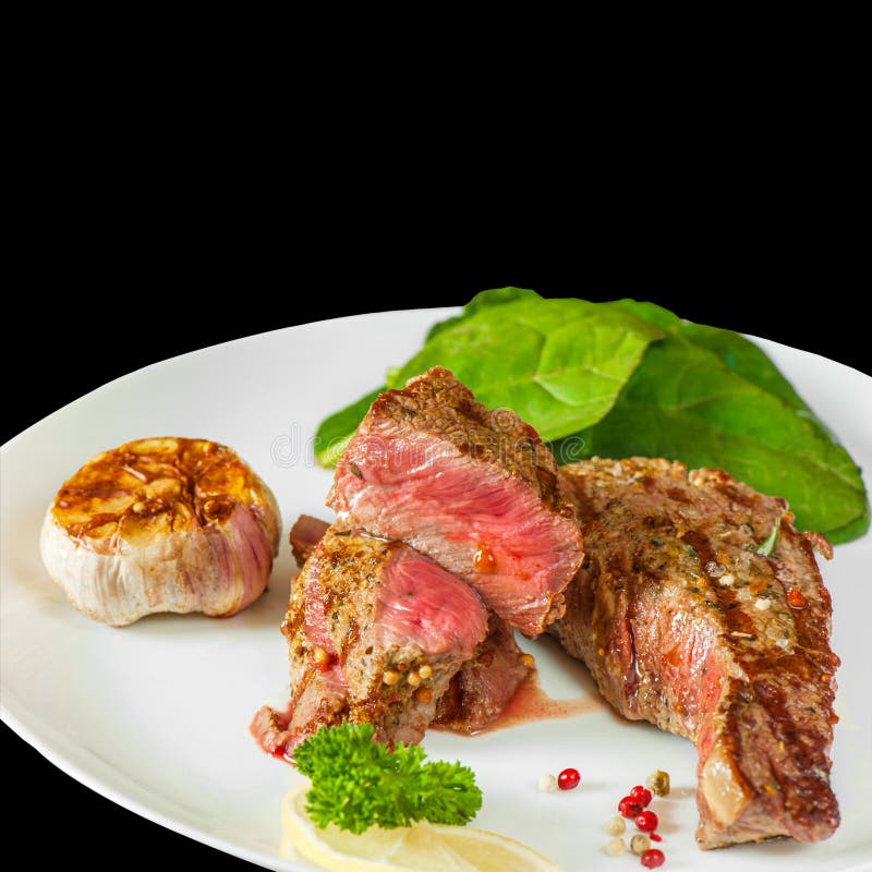 Medium Beef Steak with Blood and Vegetables on a White Plate Stock ...