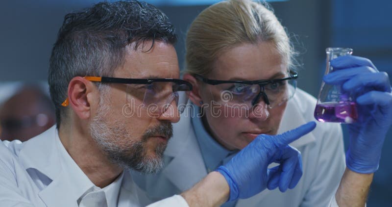 Scientists Examining Various Liquids Stock Image - Image of examining ...