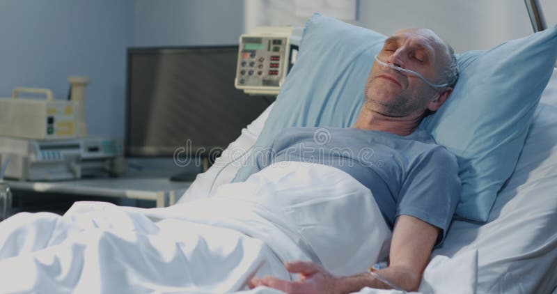 Man lying in hospital bed stock photo. Image of hospital - 145568678