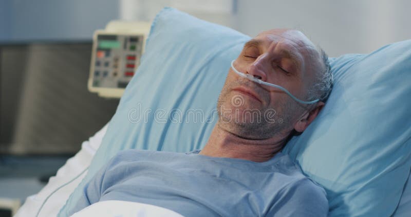 Man lying in hospital bed stock image. Image of lying - 145568703