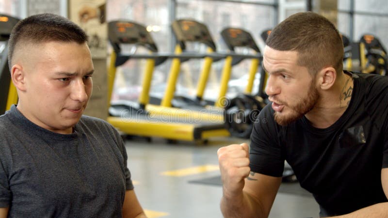Young Man Shouted at by Instructor while Working Out in Gym Stock Photo ...