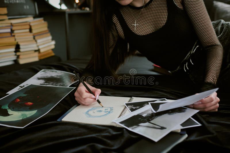 Goth Drawing Skull in Bed stock photo. Image of mysterious - 376352110
