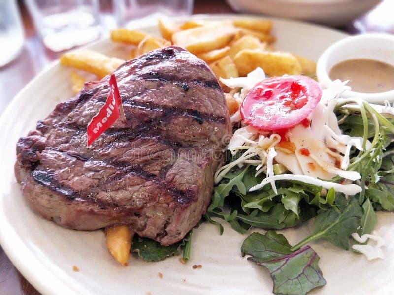 Steak with a medium flag stock photo. Image of round - 127892022